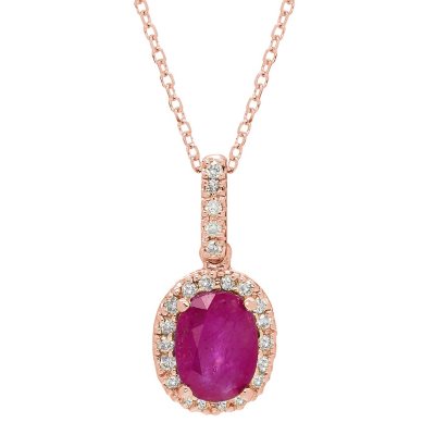 Click here for Genuine Ruby and .11CT. T. W. Diamond Pendant in 1... prices
